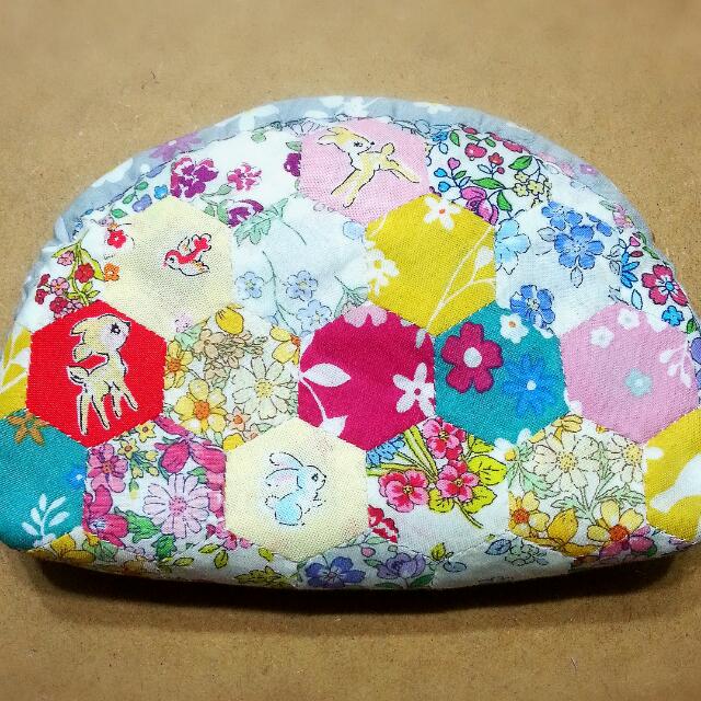 Handsewn hexagon dumpling zip pouch, Women's Fashion, Bags & Wallets ...