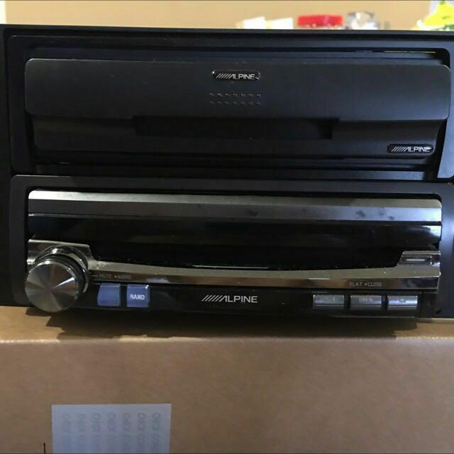 Alpine single Din flip out DVD head unit with GPS and Reverse camera ...