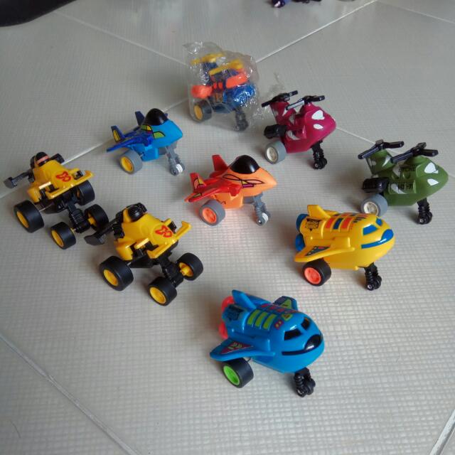 Press-down spring powered toys airplane helicopter spaceship cars ...