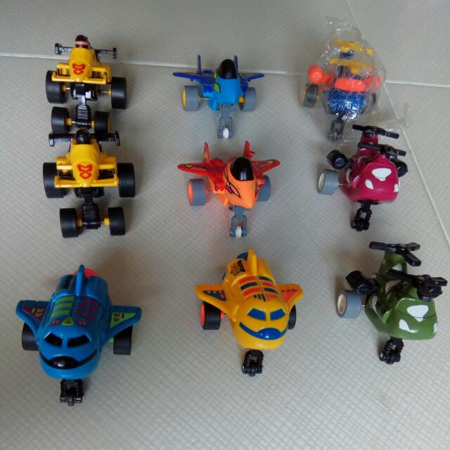 Press-down spring powered toys airplane helicopter spaceship cars ...