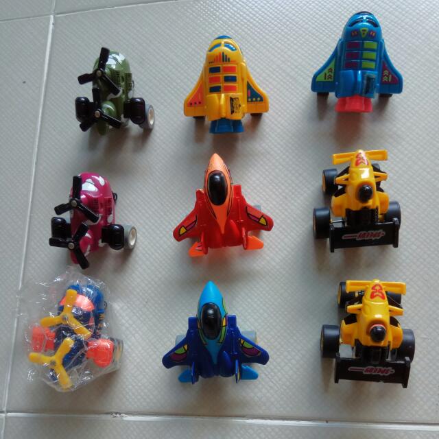 Press-down spring powered toys airplane helicopter spaceship cars ...