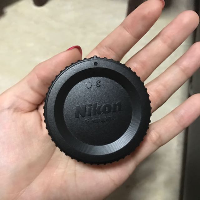 Nikon Camera Lens Cover, Photography, Cameras on Carousell