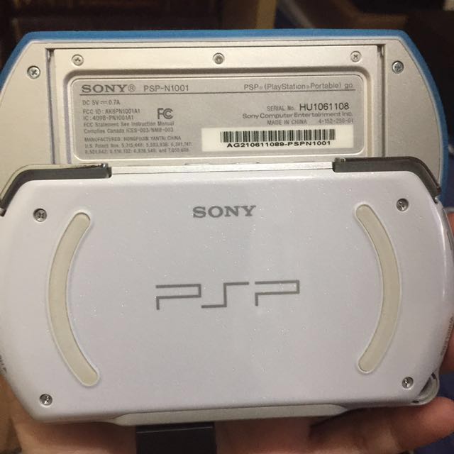 (REPRICED) PSP Go with jelly case with lots of games inside and box ...