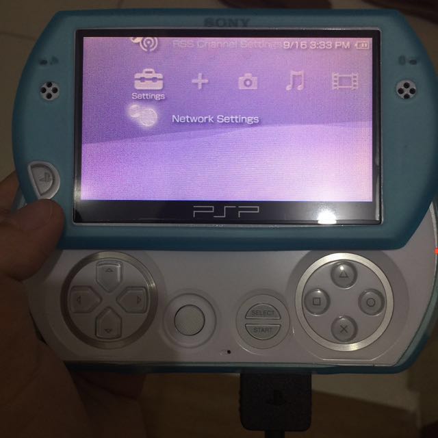 (REPRICED) PSP Go with jelly case with lots of games inside and box ...