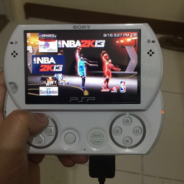 (REPRICED) PSP Go with jelly case with lots of games inside and box ...