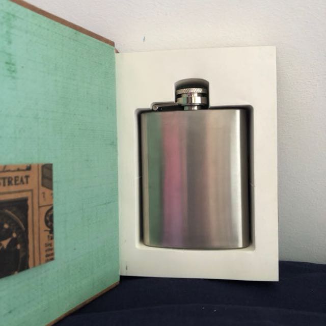Flask in a book on Carousell