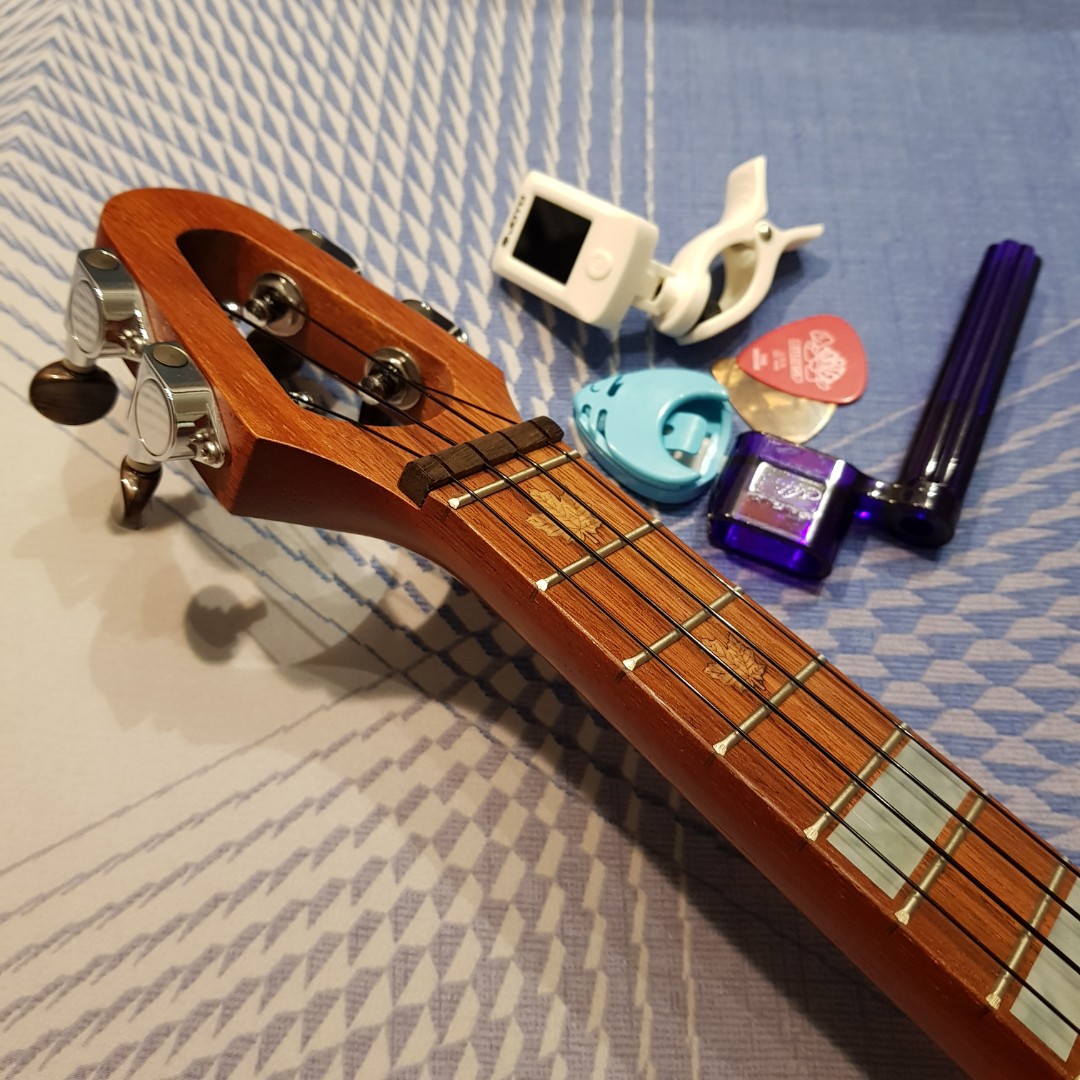 Yuan silent electric travel ukulele (RISA stick alike), Hobbies & Toys ...