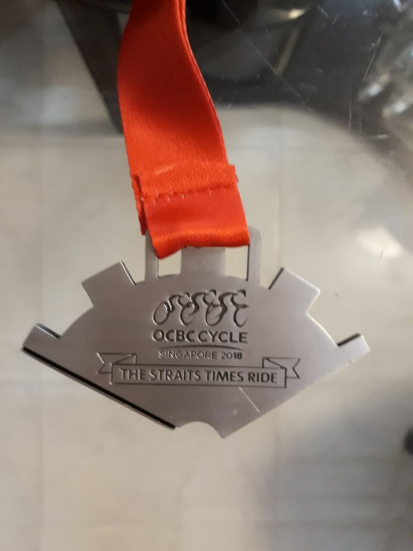 OCBC cycle 2018 medal, Men's Fashion, Activewear on Carousell