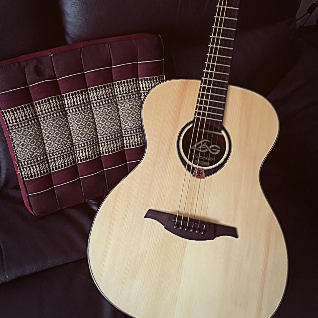 Brand new LAG Acoustic guitar with stand, bag and guitar strings ...