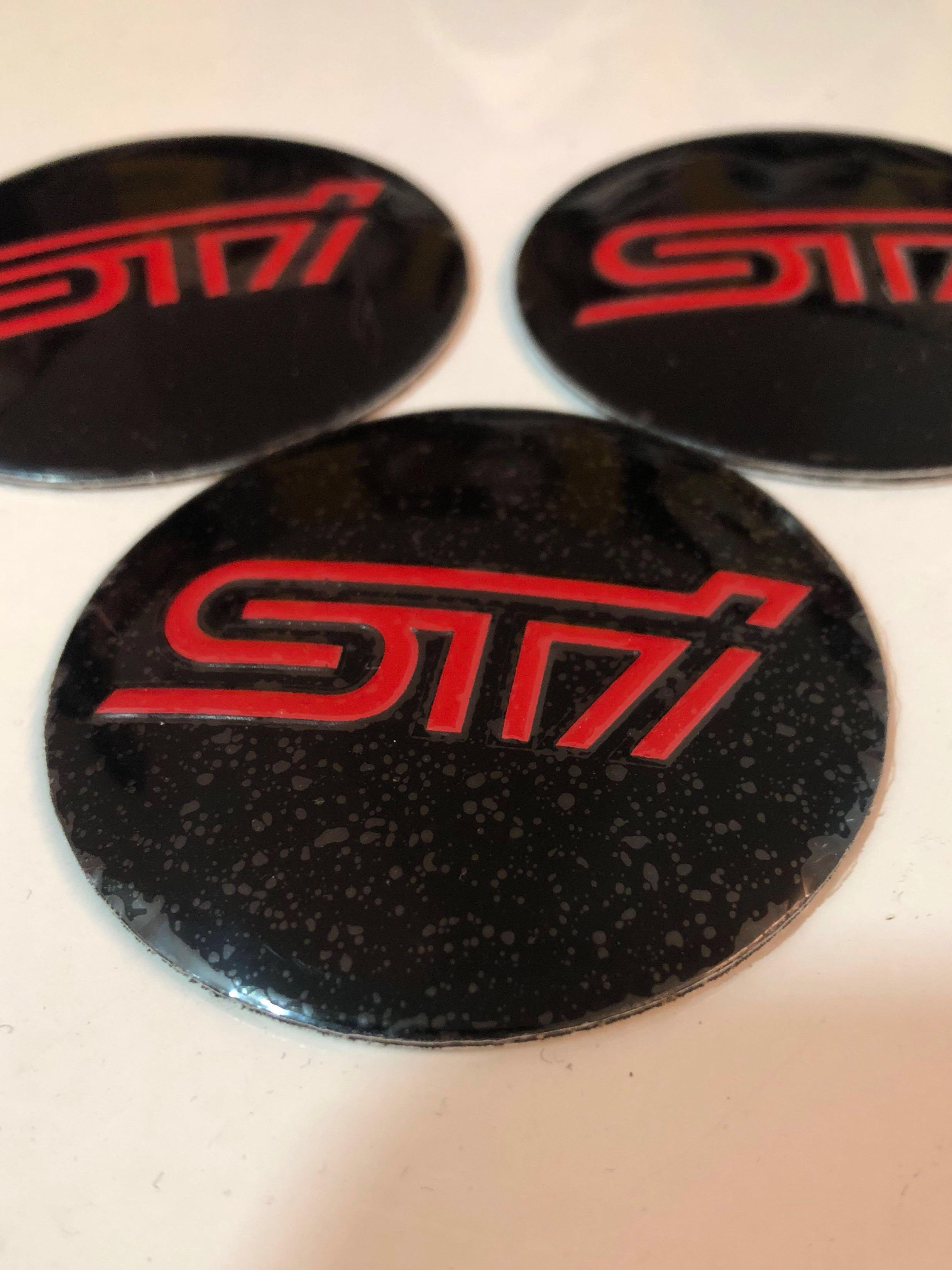 STI wheel cap 3 pieces., Car Accessories, Accessories on Carousell