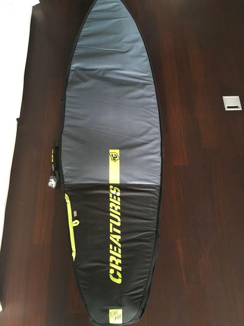 Rusty 6’2 surfboard with creatures surf bag including fins and leach ...