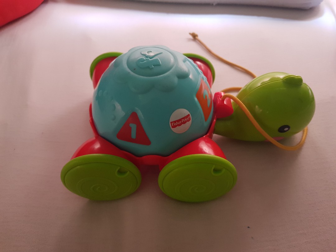 Fisher Price Pull Along Turtle, Babies & Kids, Infant Playtime on Carousell