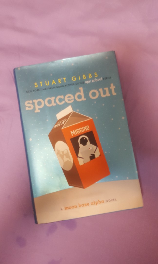 Spaced out by Stuart Gibbs, Books & Stationery, Fiction on Carousell