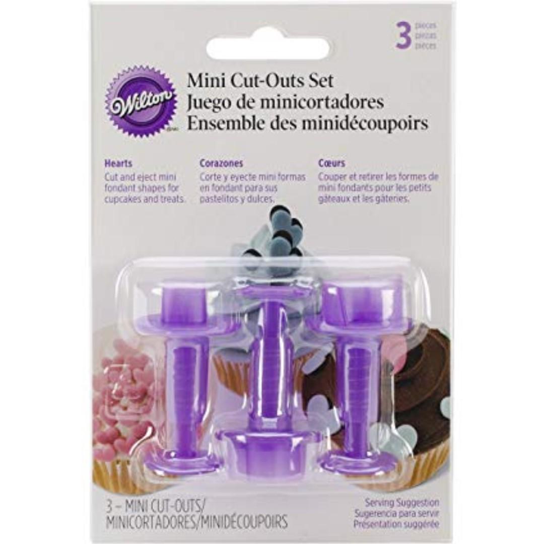 Use Wilton Mini Fondant Cut-Out Set (Classic Shapes) to cut out shapes ...
