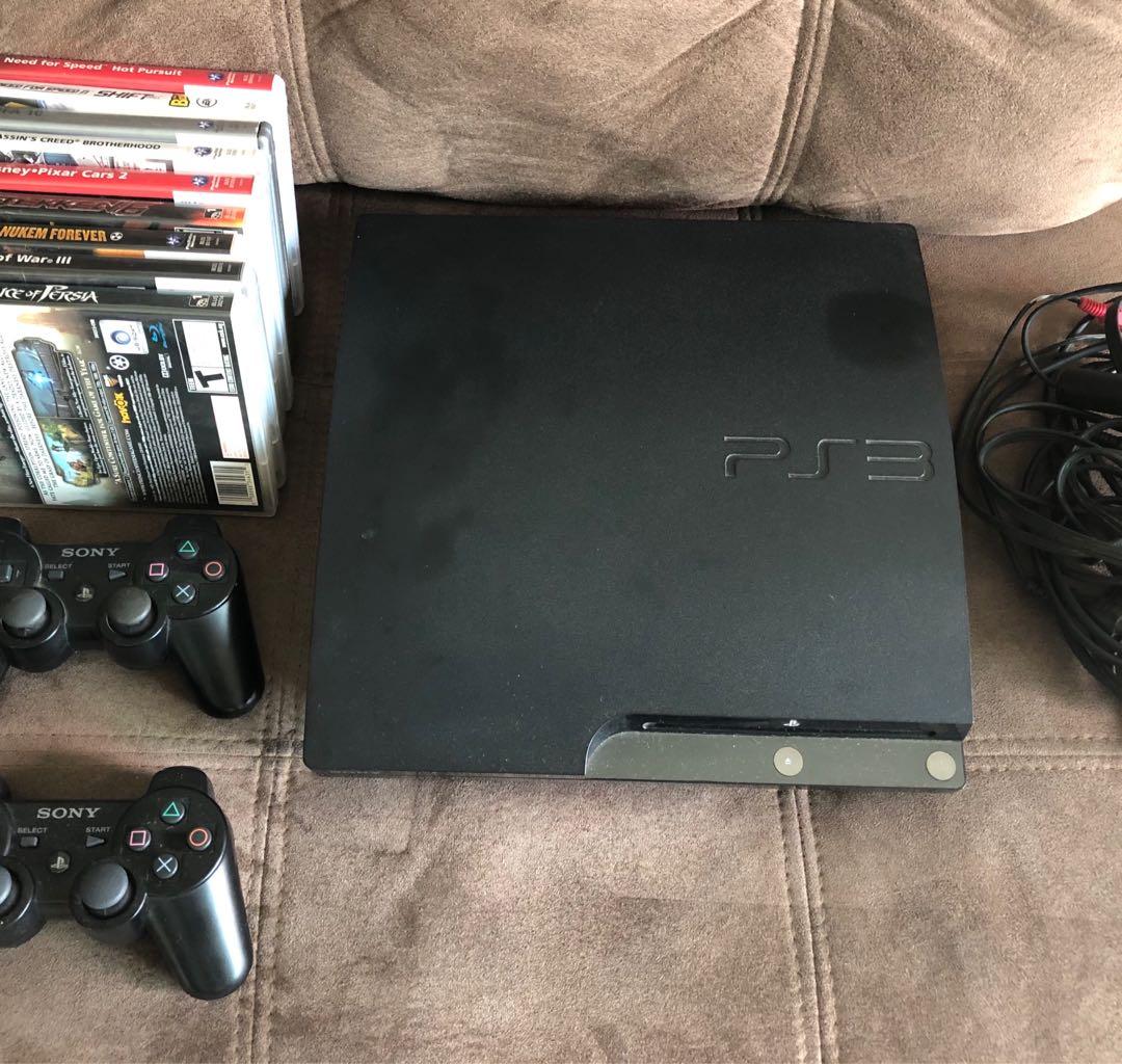 Sony PS3 + 2 DualShock Controllers + games, Video Gaming, Gaming ...