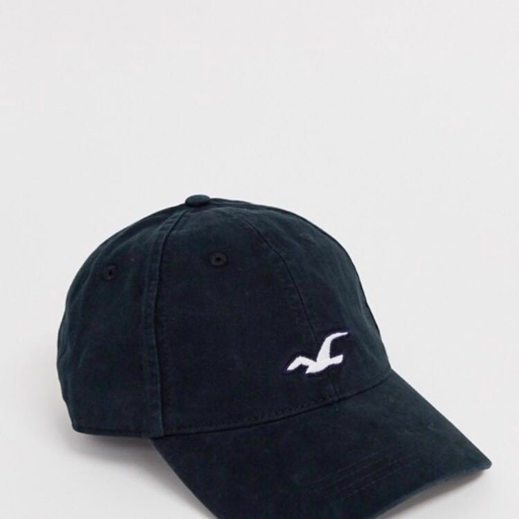 Hollister icon logo dad baseball cap in black, Men's Fashion, Watches ...
