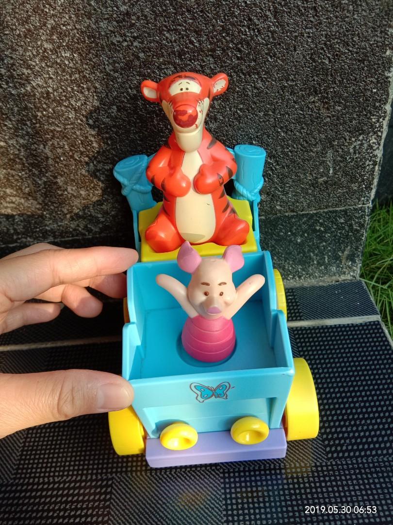 TOMY - Push and play tiger/winnie the pooh buddy buggy on Carousell