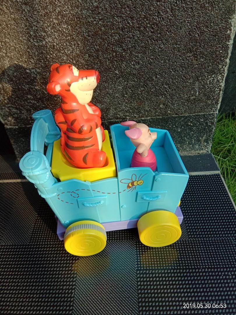 TOMY - Push and play tiger/winnie the pooh buddy buggy on Carousell