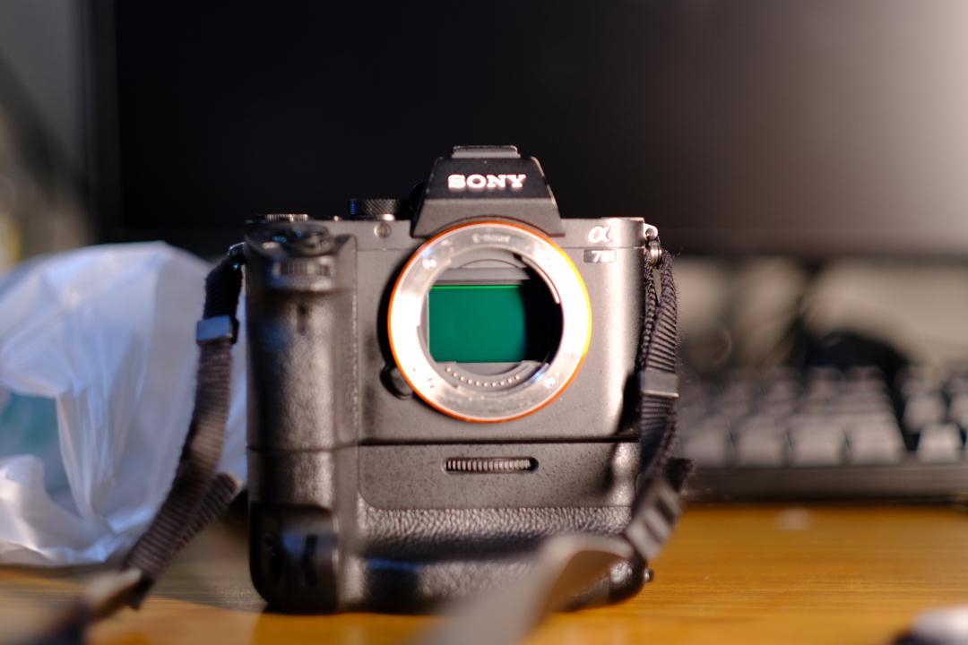 Sony A7ii body with battery grip, Photography, Cameras on Carousell