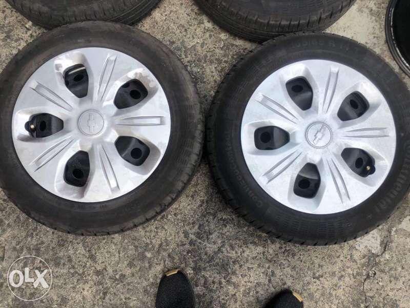 14 Chevy steel Rims 4Holes pcd 100 with 165 65 R14 Continental tires ...