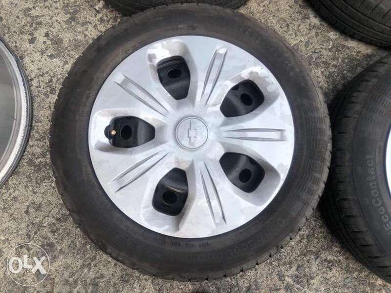 14 Chevy steel Rims 4Holes pcd 100 with 165 65 R14 Continental tires ...