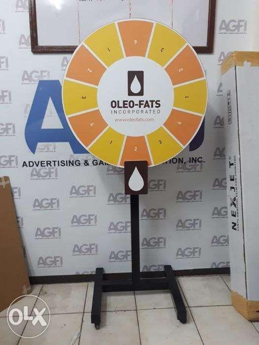 Customized spin wheel with wood and metal stand for corporate game on ...