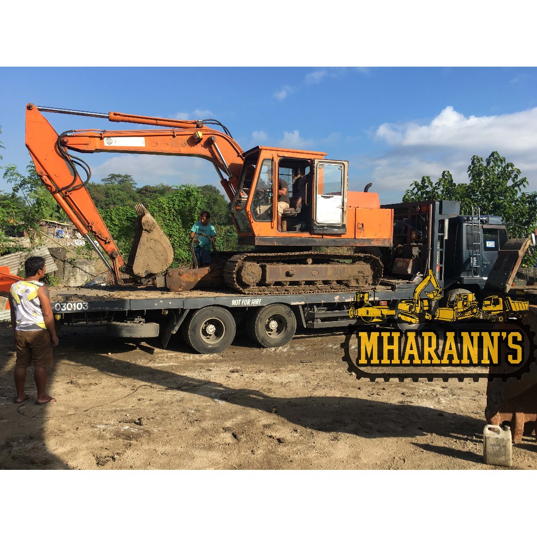 Backhoe Selfloading Bulldozer Pison Boom Truck Rental Hauling Services