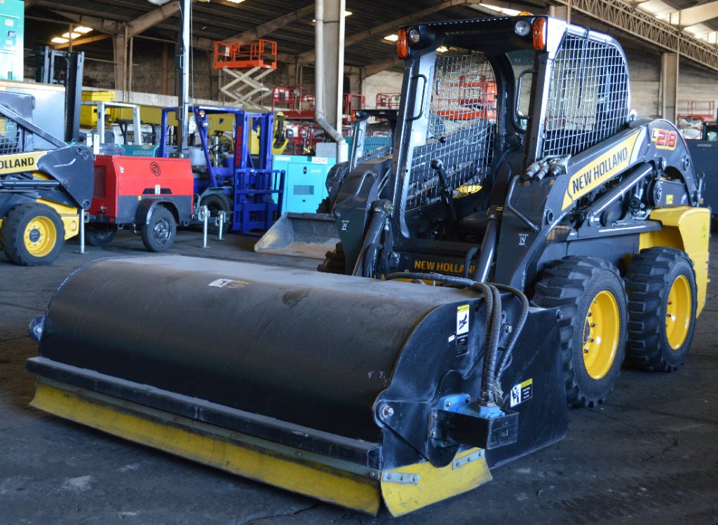 Sweeper mounted on a Skid Steer Loader similar to Bobcat for rent ...