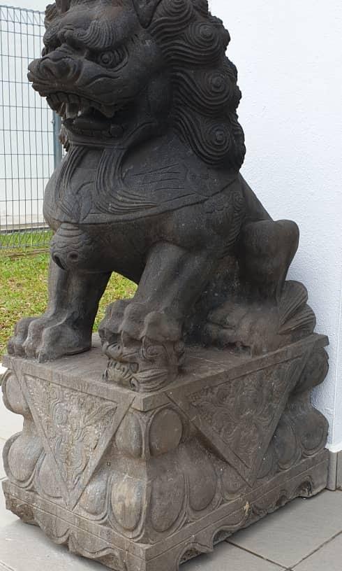A pair of extremely heavy granite foo dogs ..old pieces antique ...
