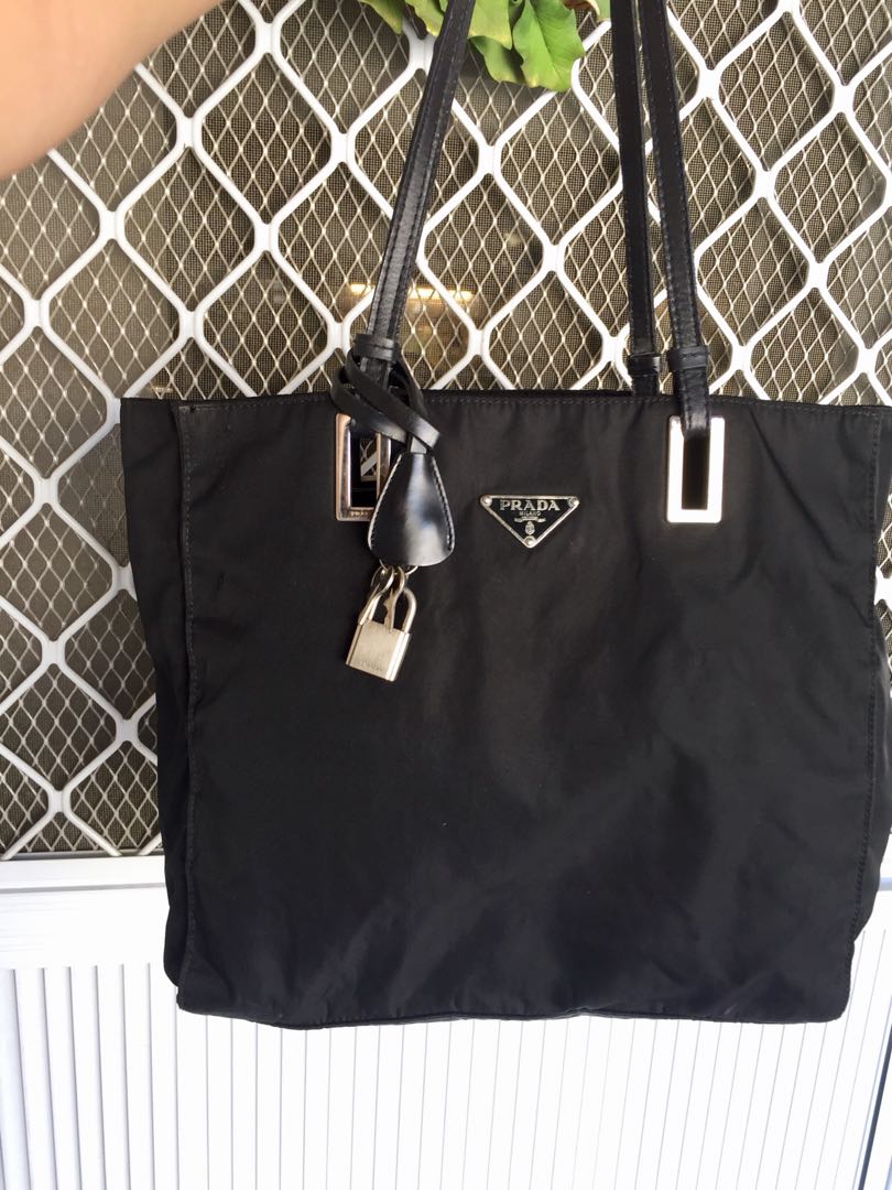 Prada lock and key with leather strap authentic, Luxury, Bags & Wallets ...