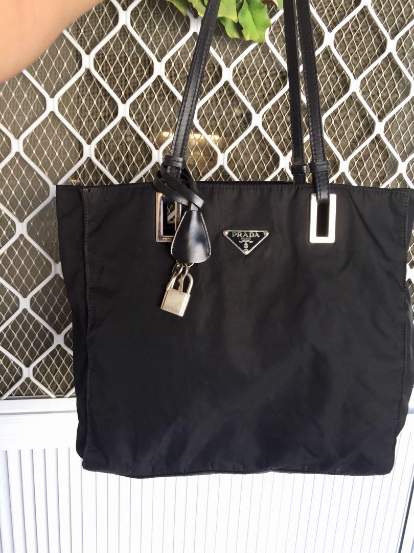 Prada lock and key with leather strap authentic, Luxury, Bags & Wallets ...