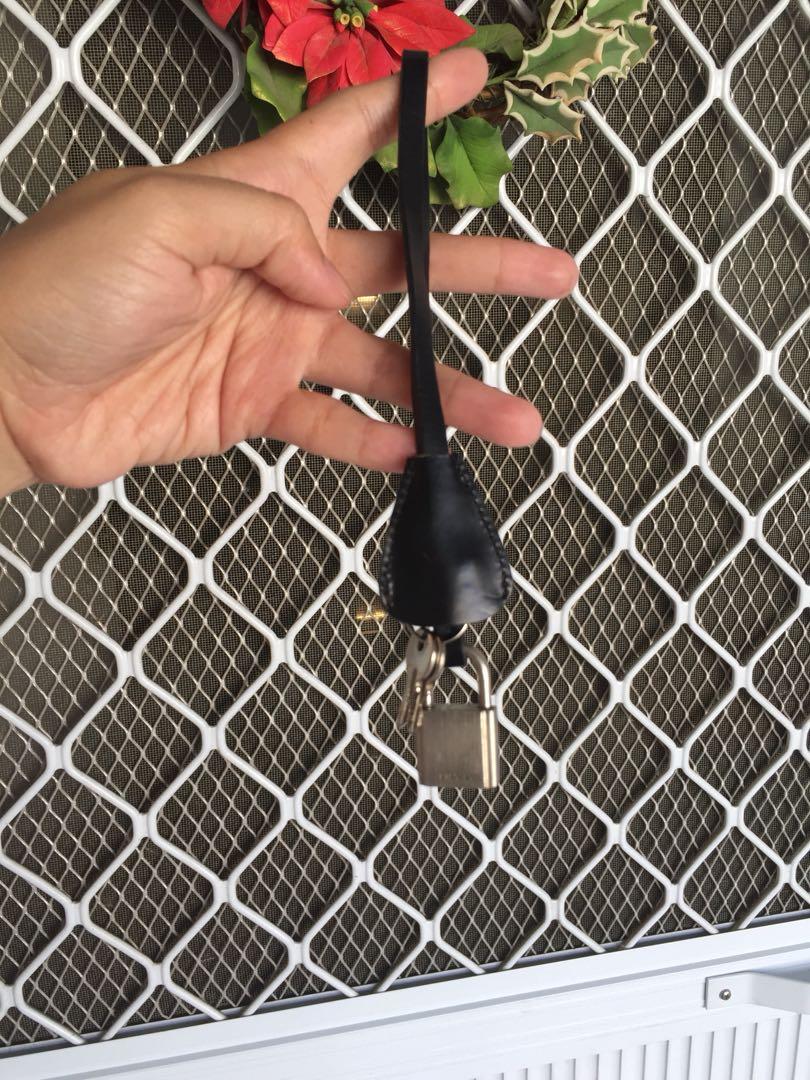 Prada lock and key with leather strap authentic, Luxury, Bags & Wallets ...