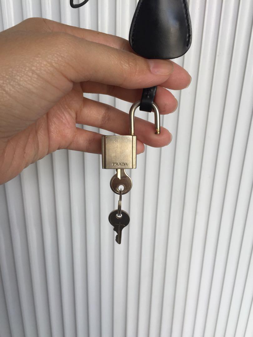 Prada lock and key with leather strap authentic, Luxury, Bags & Wallets ...