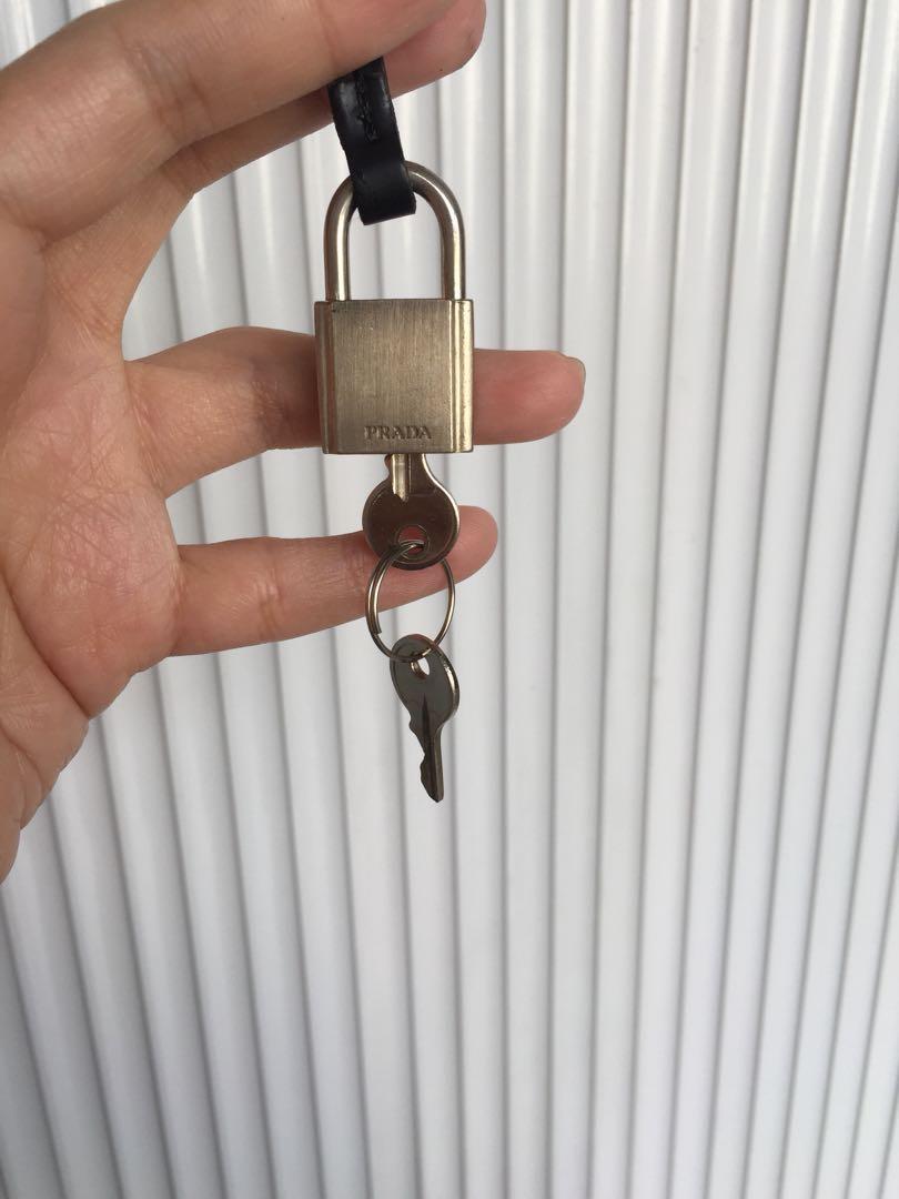 Prada lock and key with leather strap authentic, Luxury, Bags & Wallets ...