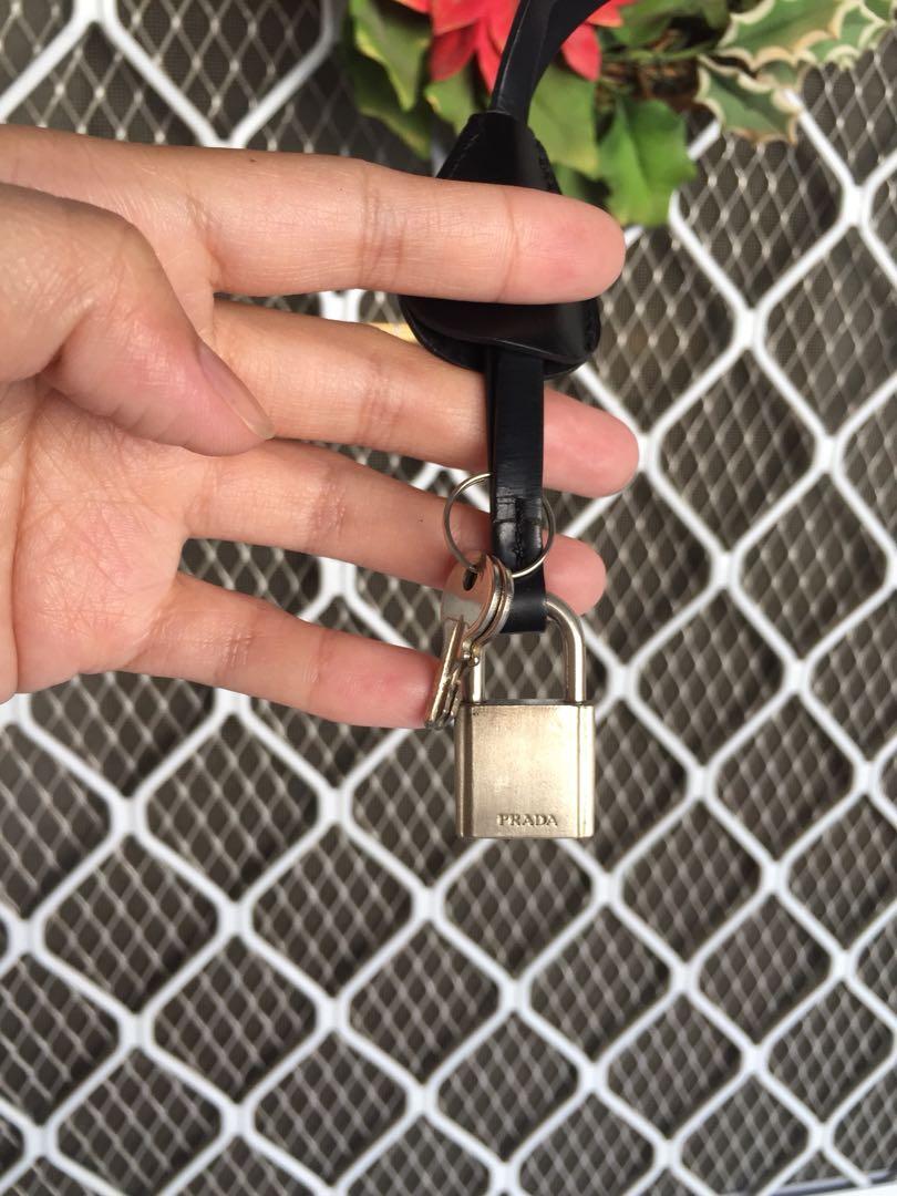Prada lock and key with leather strap authentic, Luxury, Bags & Wallets ...