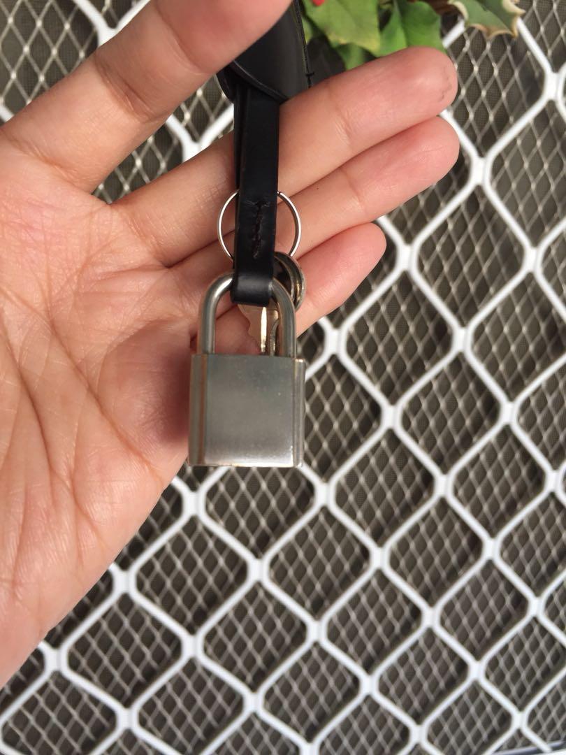 Prada lock and key with leather strap authentic, Luxury, Bags & Wallets ...