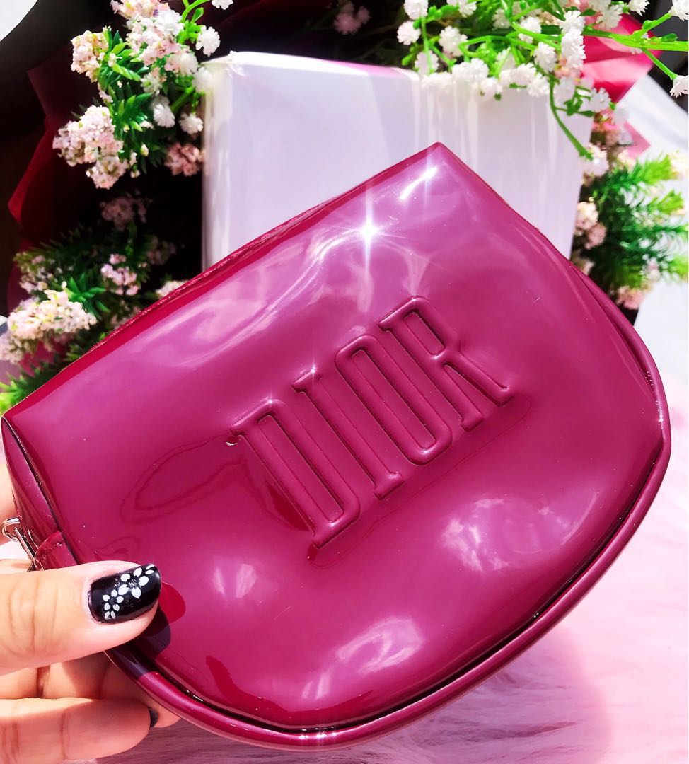 Dior beauty maroon pouch, Luxury, Bags & Wallets on Carousell