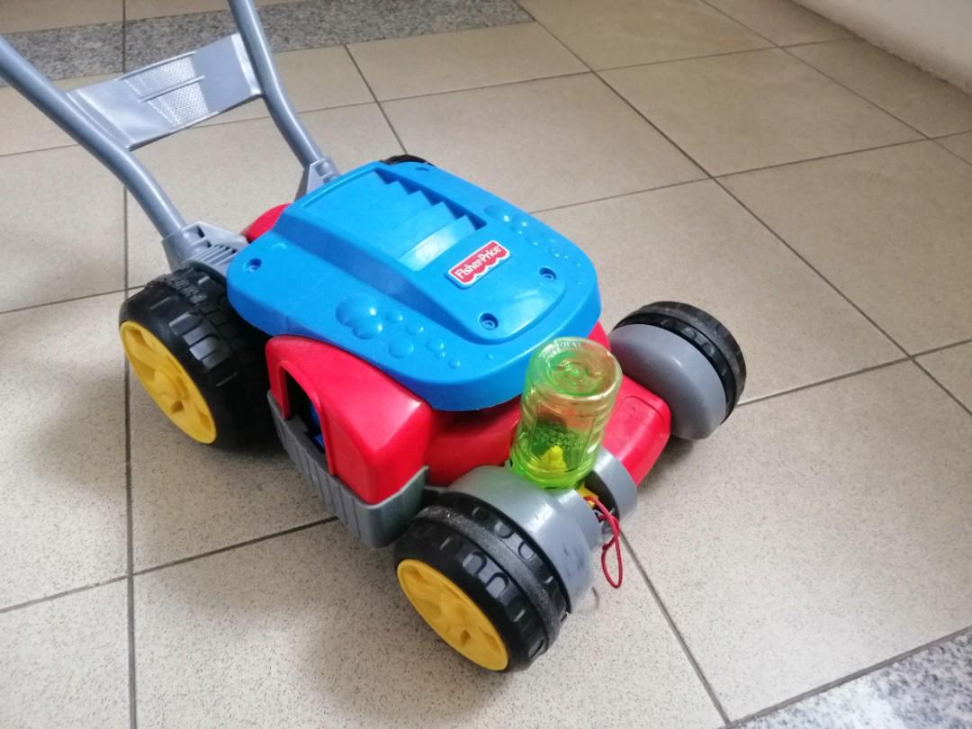 Toy Lawn mower.. With mechanical sound effect. Not requiring batteries ...