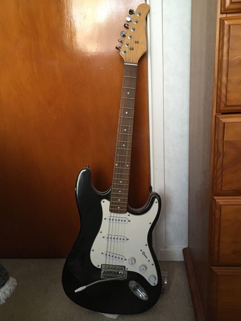 Black electric guitar, Music Instruments on Carousell