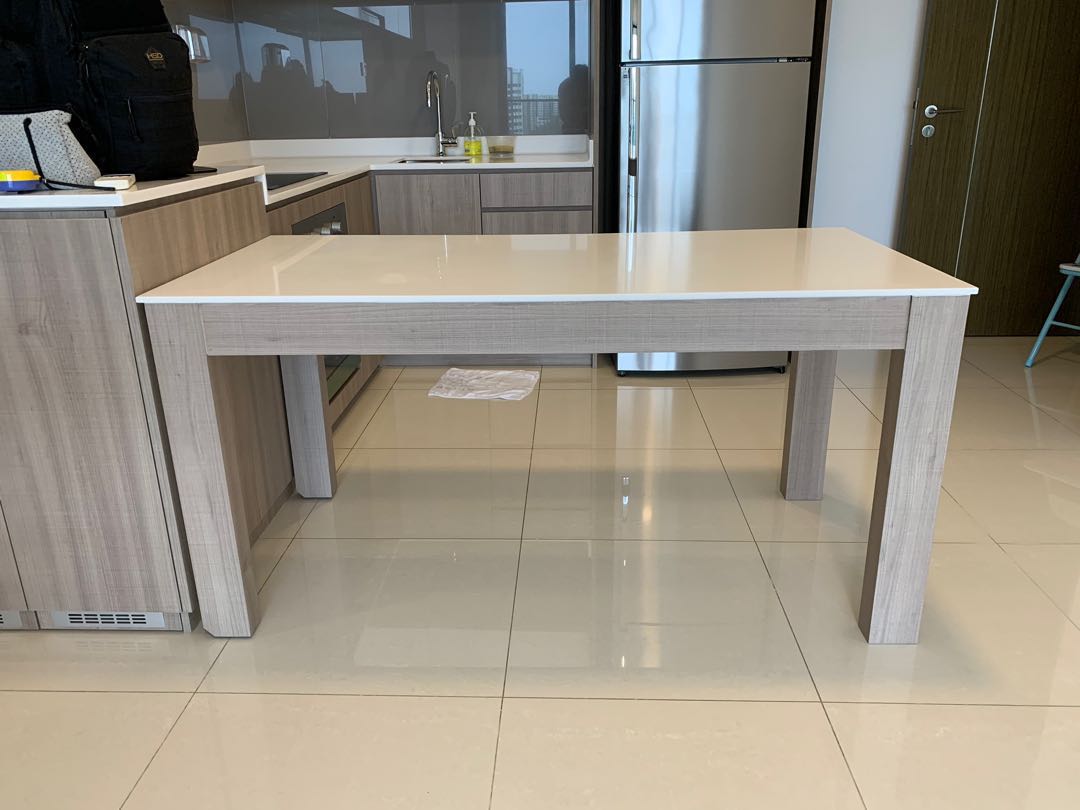 Dining table. Cream white hard top. Solid and heavy with bloom like ...