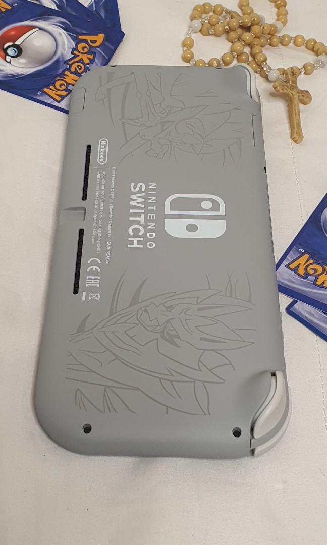 Nintendo Switch Lite Pokemon Edition like new with Zelda BOTW and ...