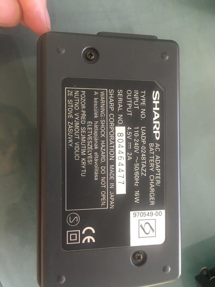 Sony/Sharp battery charger for cameras, Photography, Cameras on Carousell