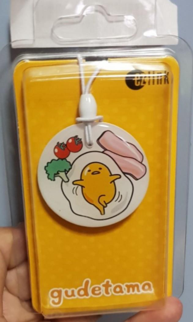 Expired sanrio gudetama ezlink charm, Everything Else on Carousell