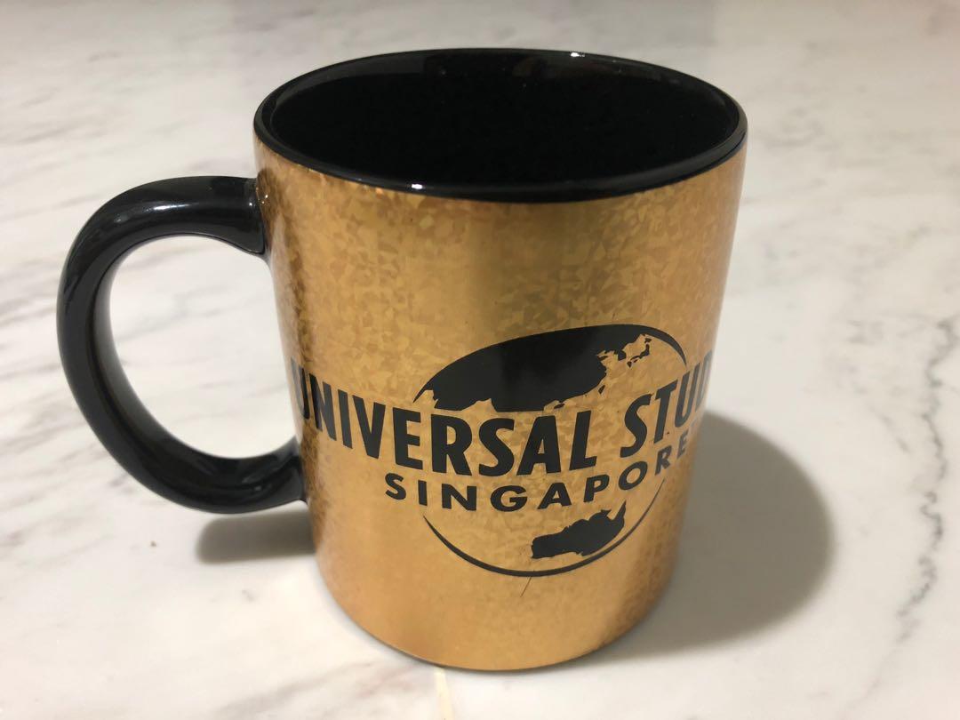 Universal studios golden mug, Everything Else on Carousell