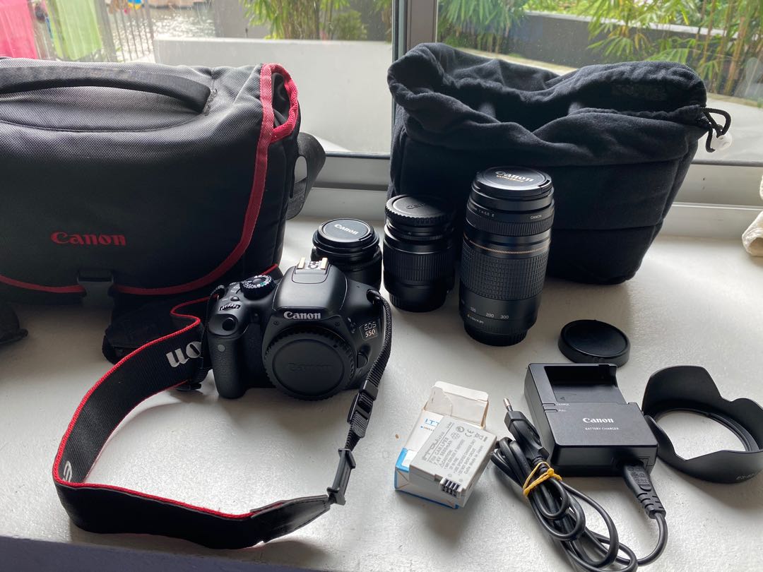 Canon 550 DSLR with prime lens, Photography, Cameras on Carousell