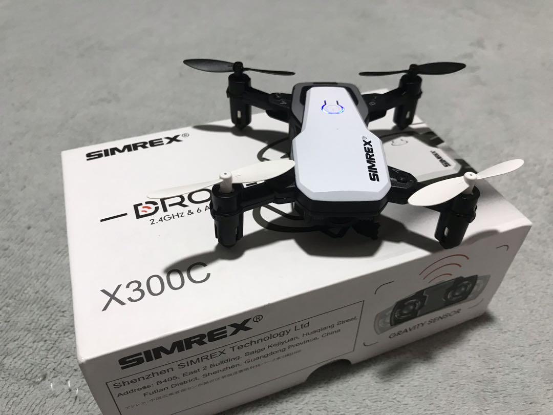 SIMREX X300C 2.4GHz &6 AXIS GYRO DRONE, Photography, Drones on Carousell
