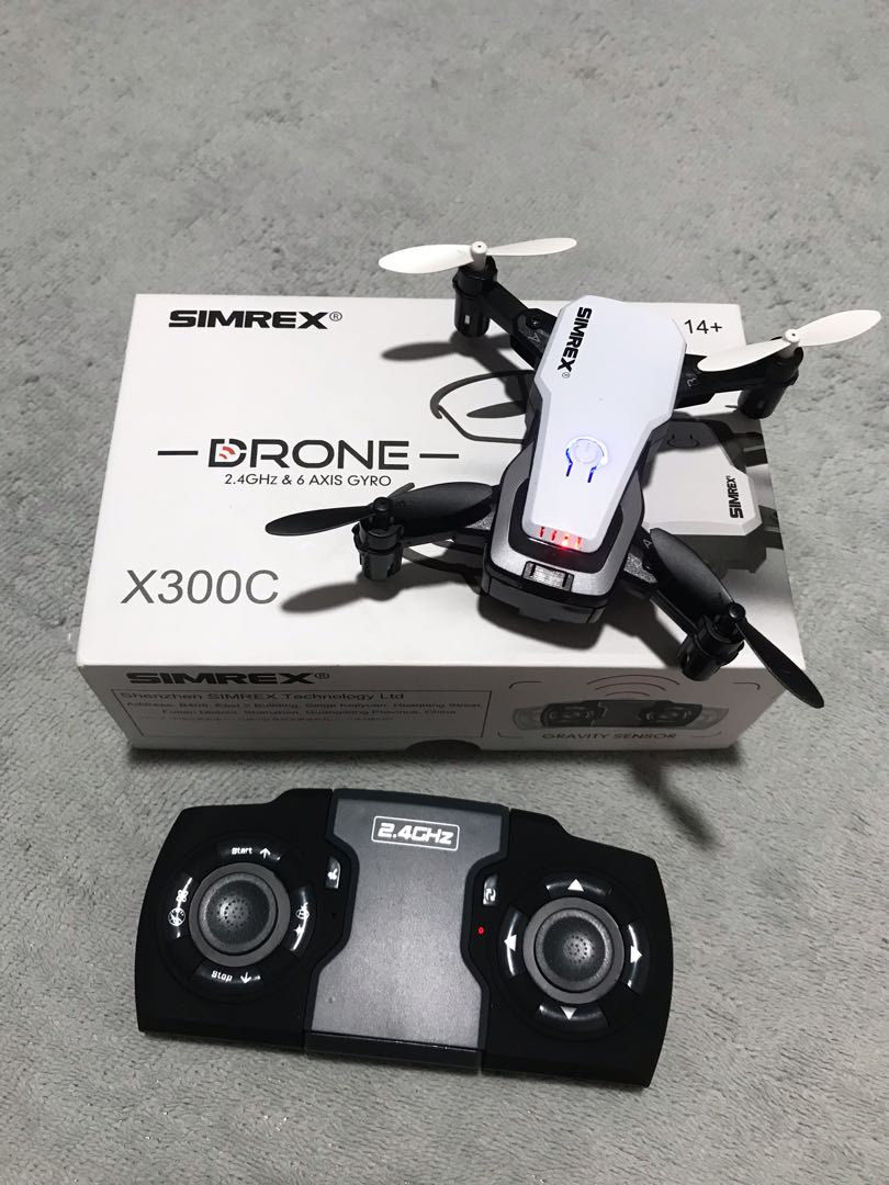 SIMREX X300C 2.4GHz &6 AXIS GYRO DRONE, Photography, Drones on Carousell