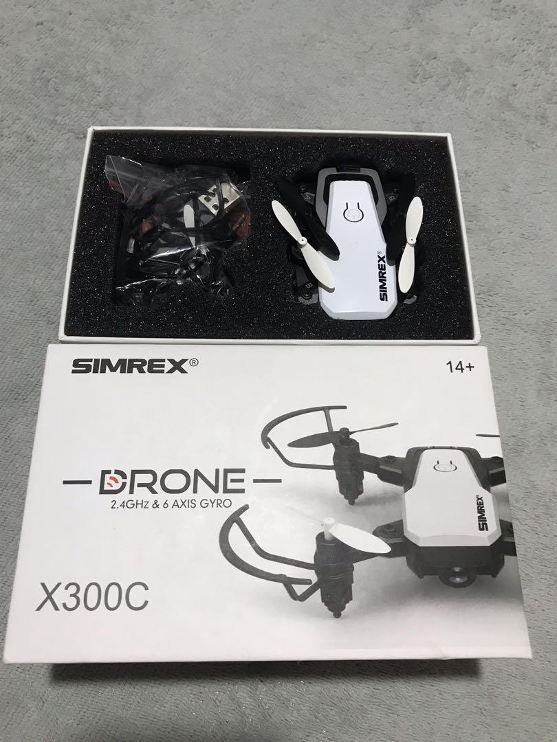 SIMREX X300C 2.4GHz &6 AXIS GYRO DRONE, Photography, Drones on Carousell