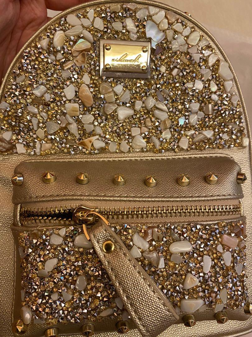 Gold mini backpack, Women's Fashion, Bags & Wallets, Backpacks on Carousell