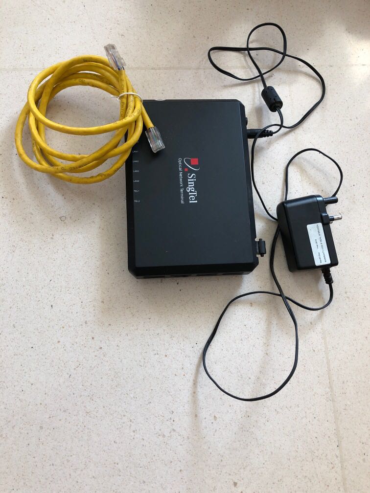 SingTel optical network terminal with adaptor and network cable ...